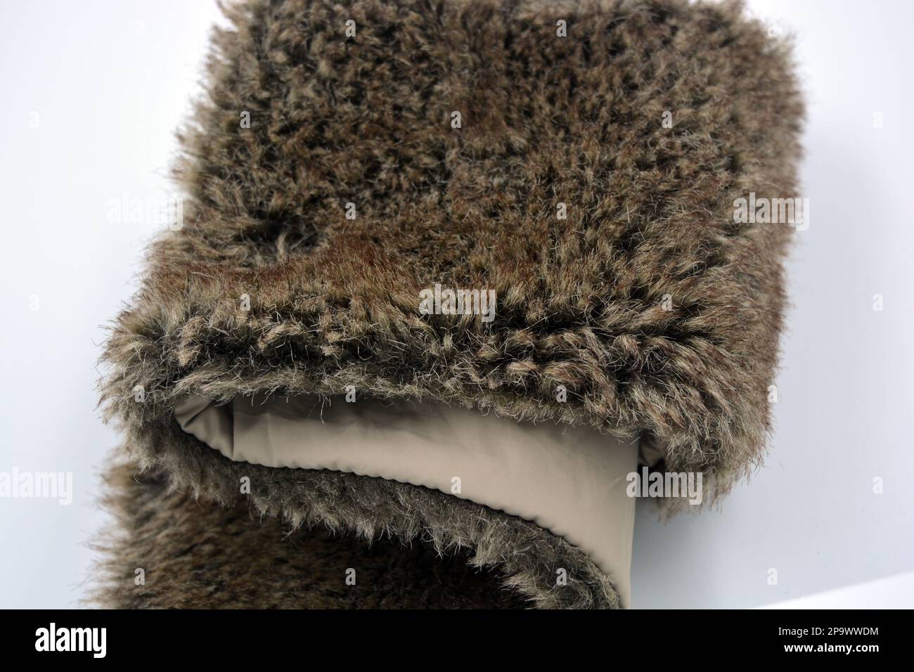 Fluffy synthetic fabric in the form of natural cinnamon yellow fur with ...