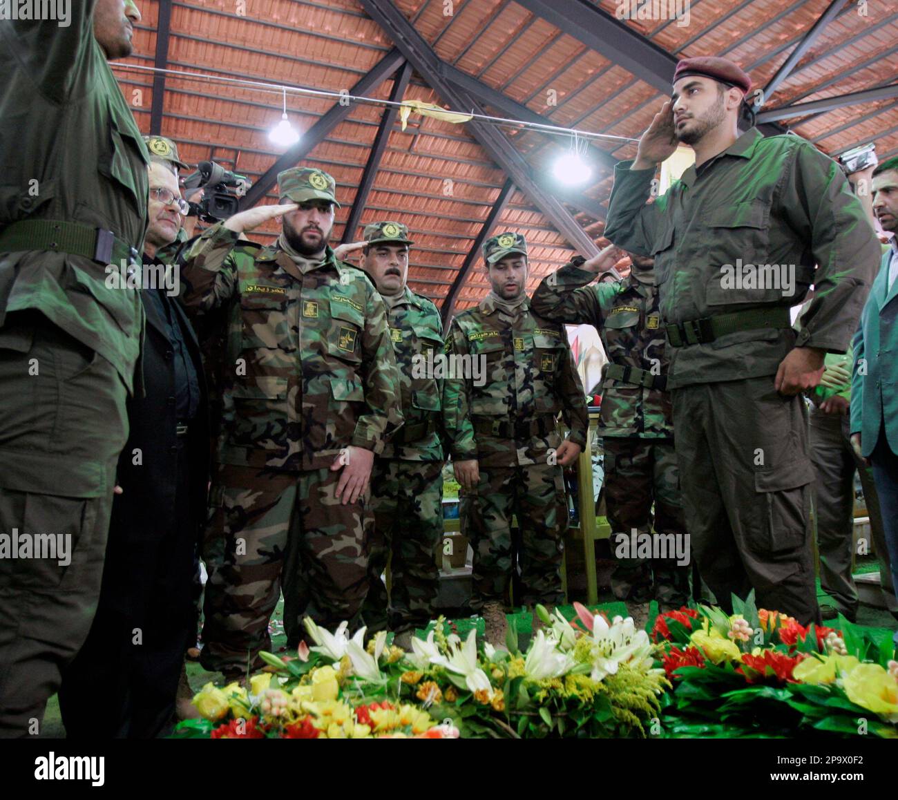Released prisoners from left, Khader Zeidan, Samir Kantar, and Maher Kourani, salute as they ...
