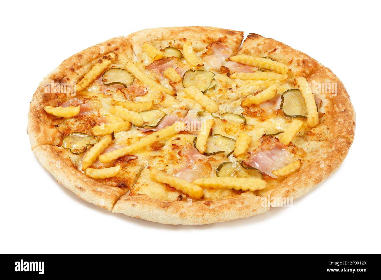 Side view on italian pizza with fries, ham and pickled cucumbers ...