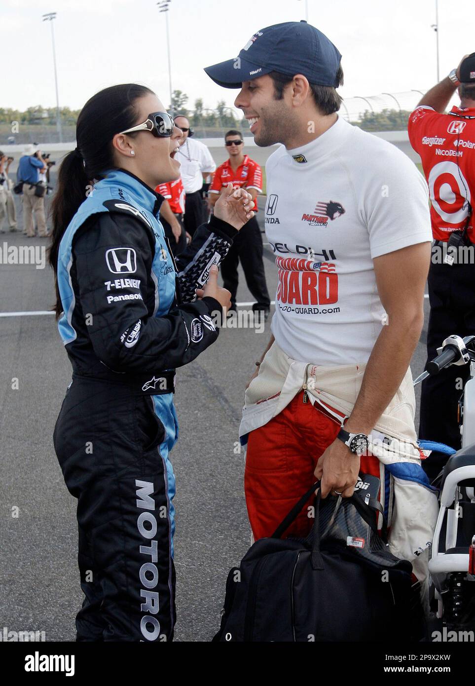 IRL driver Vitor Meira of Brazil, right, talks with driver Danica ...