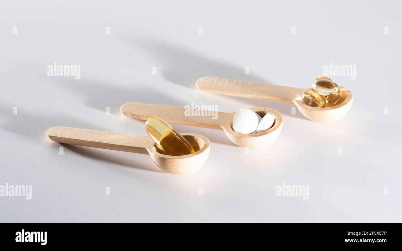 Spoons with vitamins, Vitamin D, omega 3, omega 6, Food supplement oil ...