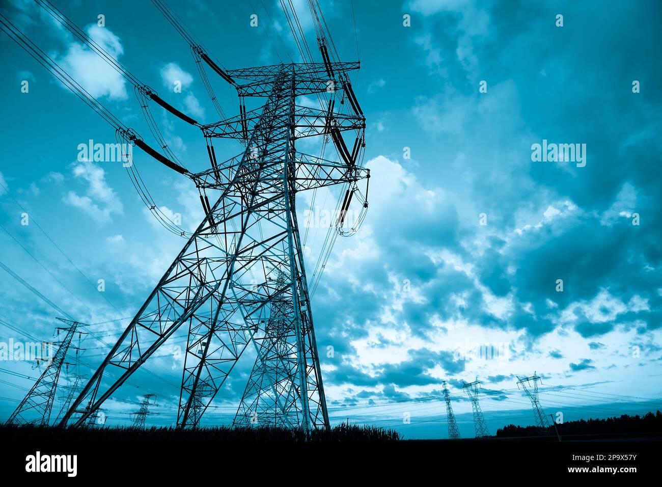 Electric tower, silhouette at sunset Stock Photo - Alamy