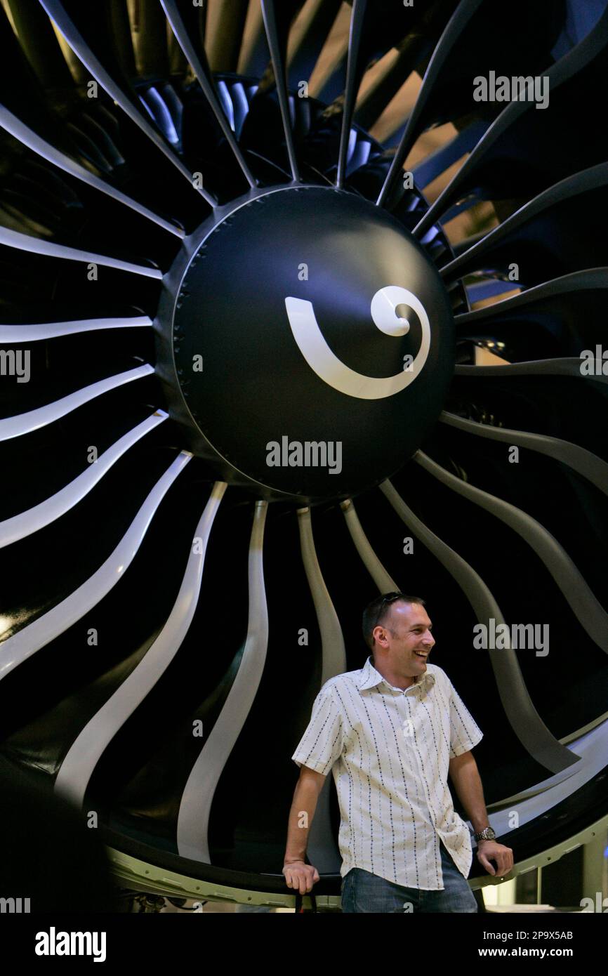 A visitor has his picture taken in front of a life-size model of the ...