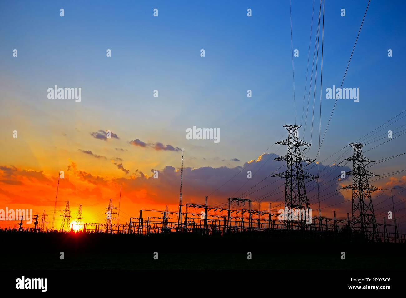 Electric tower, silhouette at sunset Stock Photo - Alamy