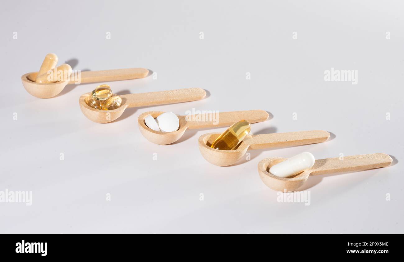 Spoons with vitamins, Vitamin D, omega 3, omega 6, Food supplement oil ...