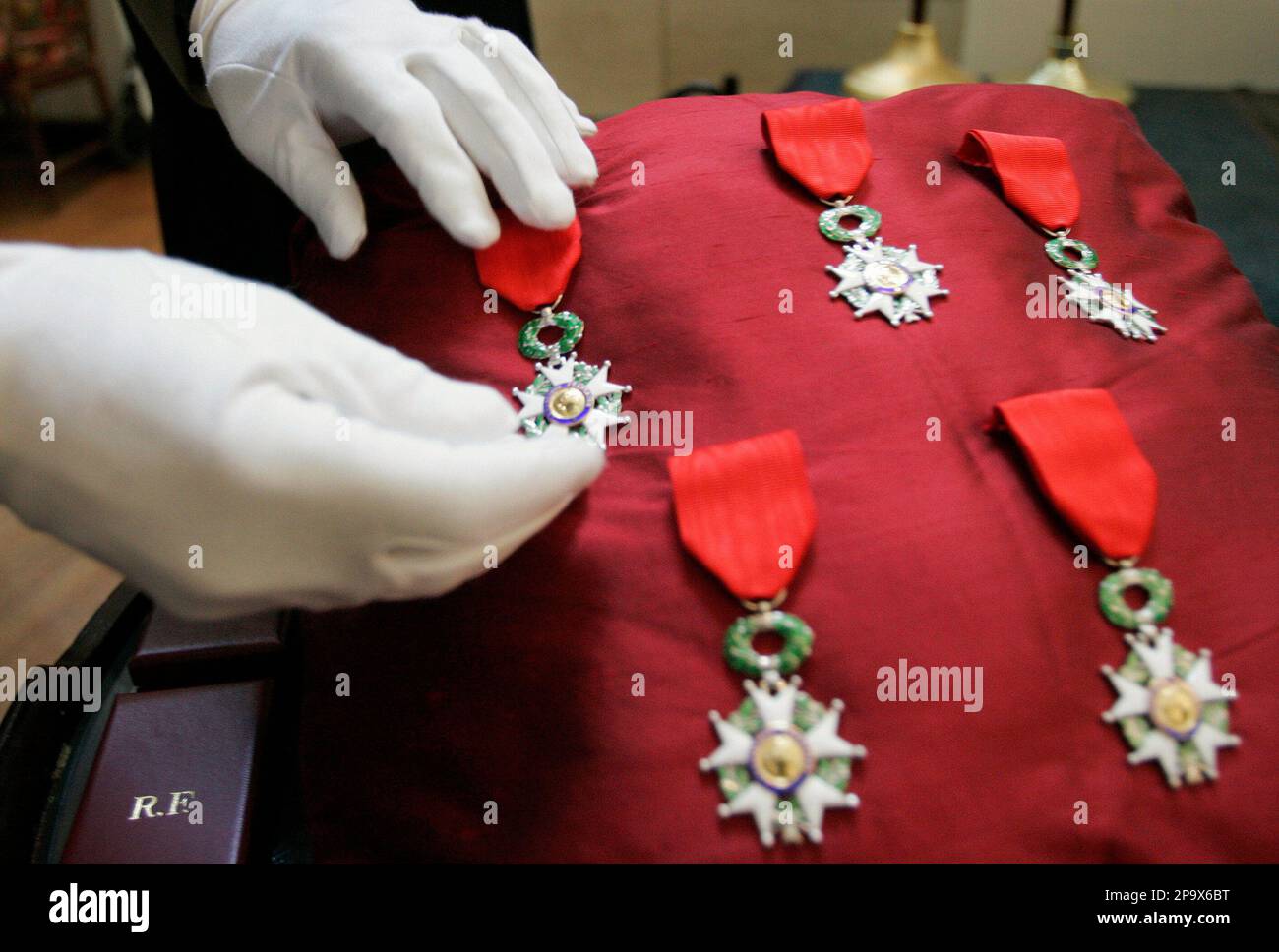 French Army Reserve Col. Mathieu Petitjean, wears white gloves as he ...