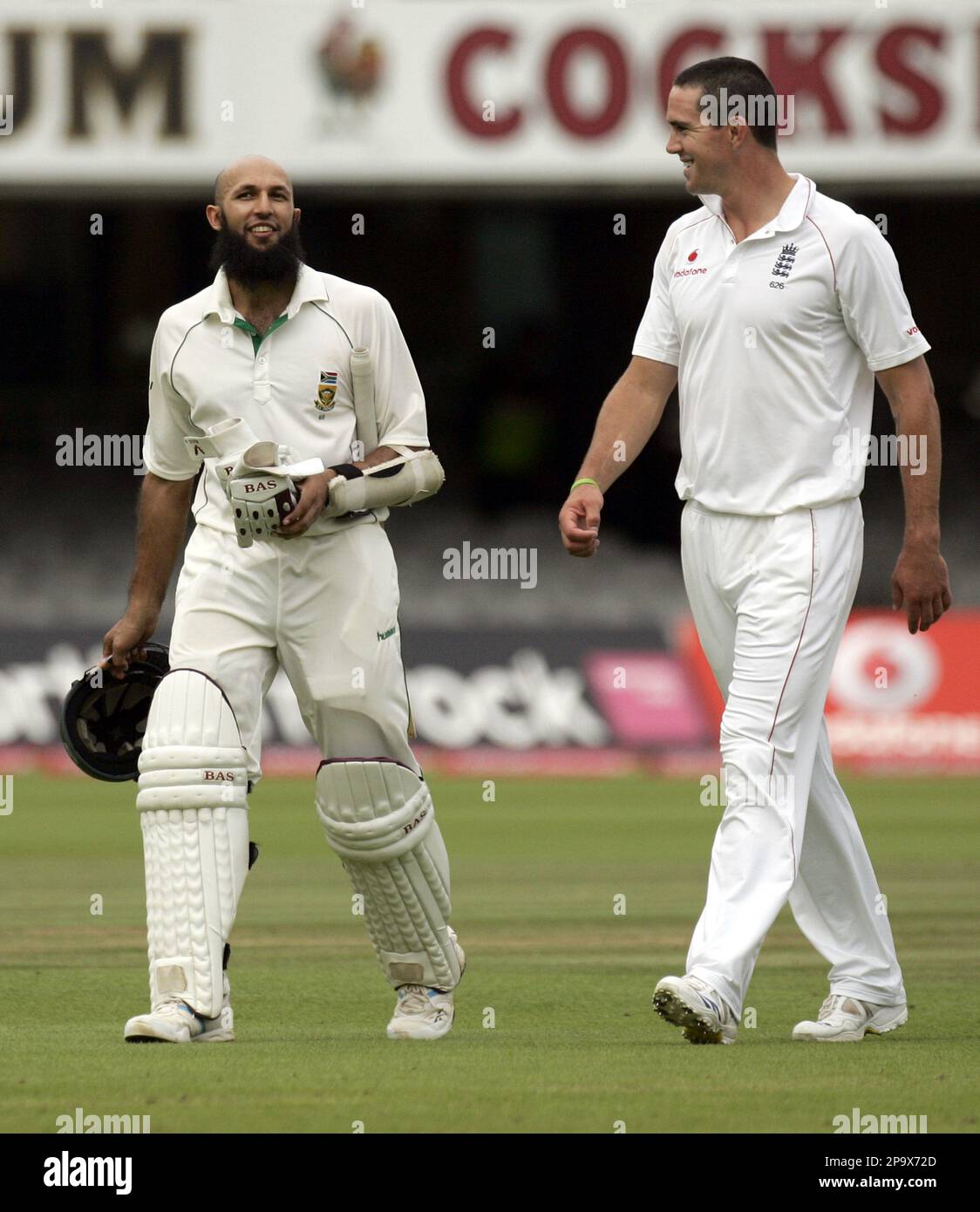 South Africa's Hashim Amla, left, shares a joke with England's Kevin ...