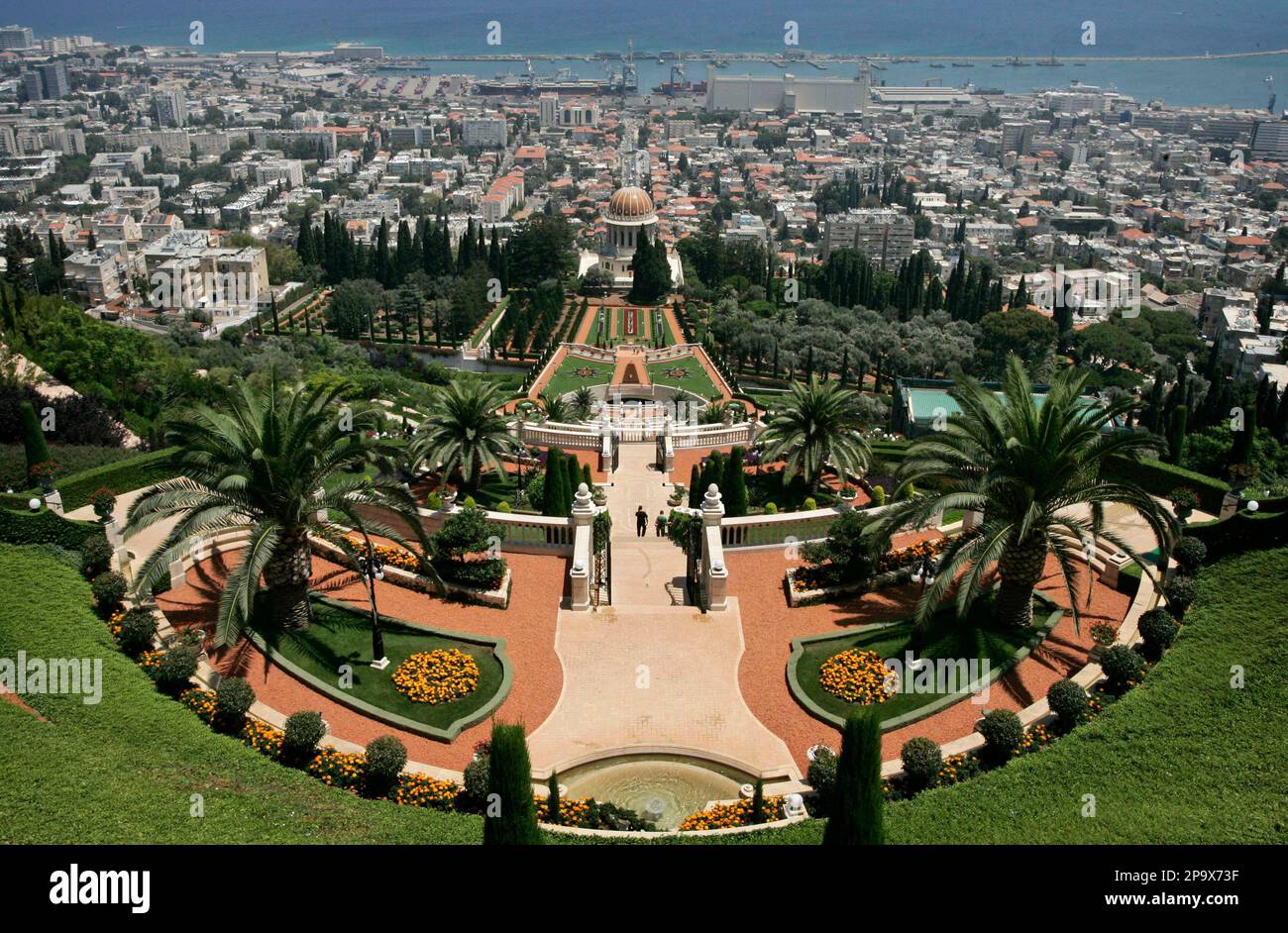 Visitors walk in the gardens in the Baha'i temple in the northern ...