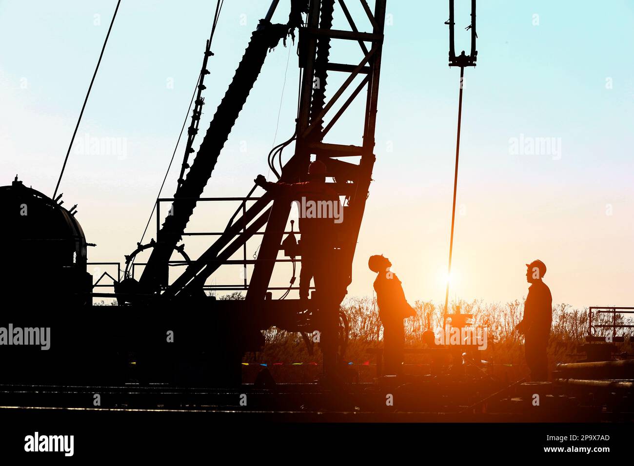 the oil workers are working Stock Photo - Alamy