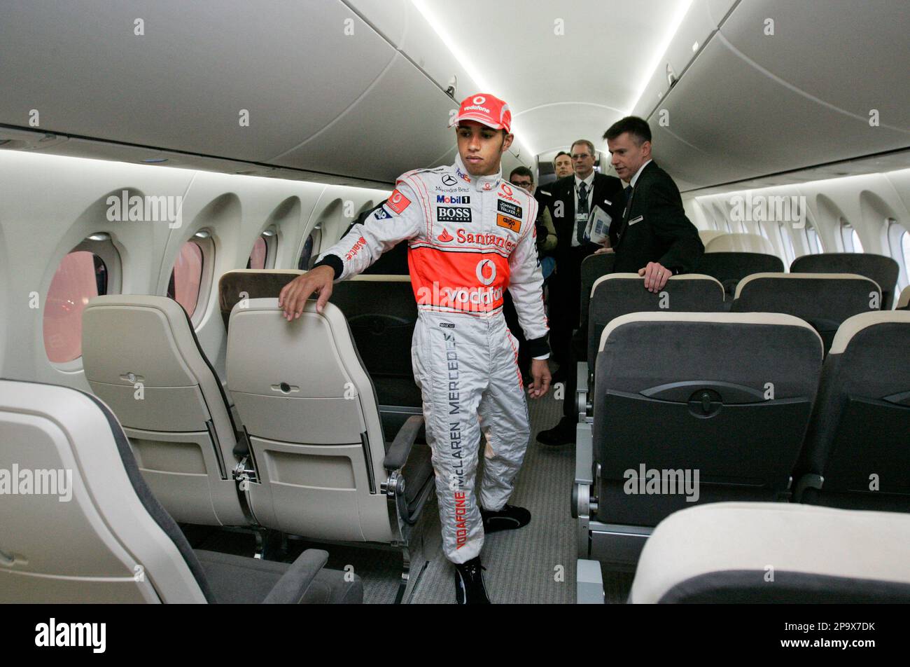 British Formula One driver Lewis Hamilton walks in a model cabin of the ...