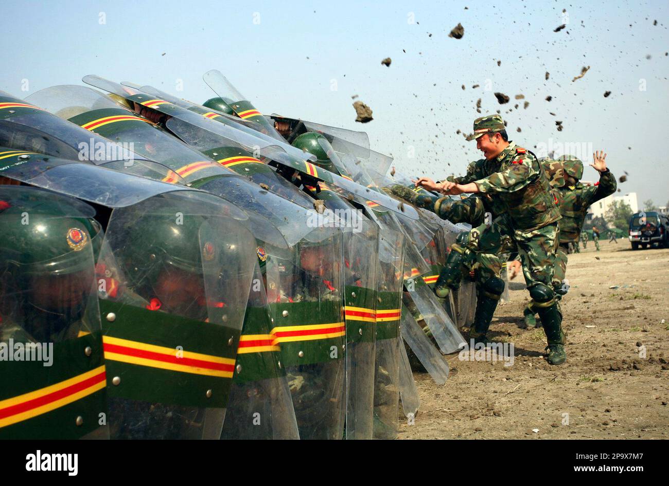 Paramilitary police officers exercise in a mock riot in Wuhan in China ...