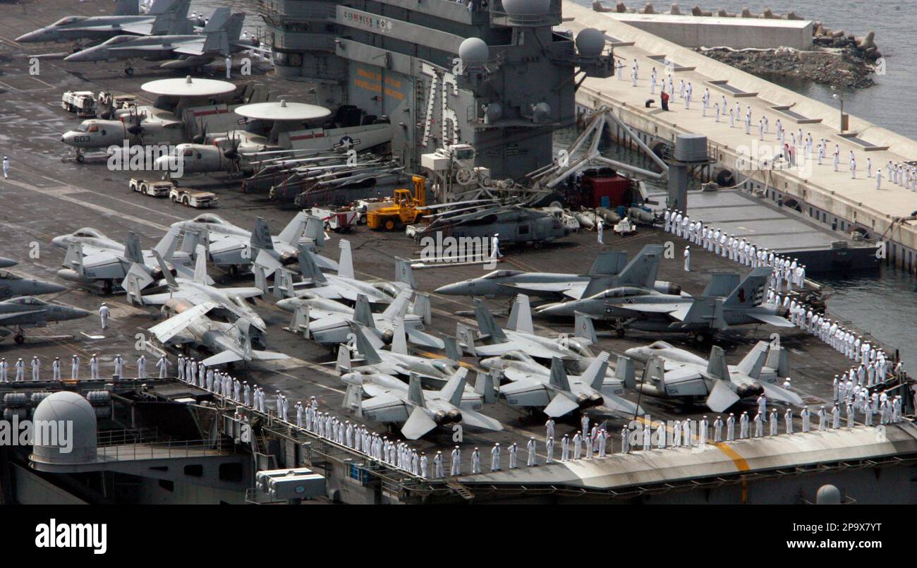 Crew Members Of U S Aircraft Carrier Uss Ronald Reagan Stand Near The