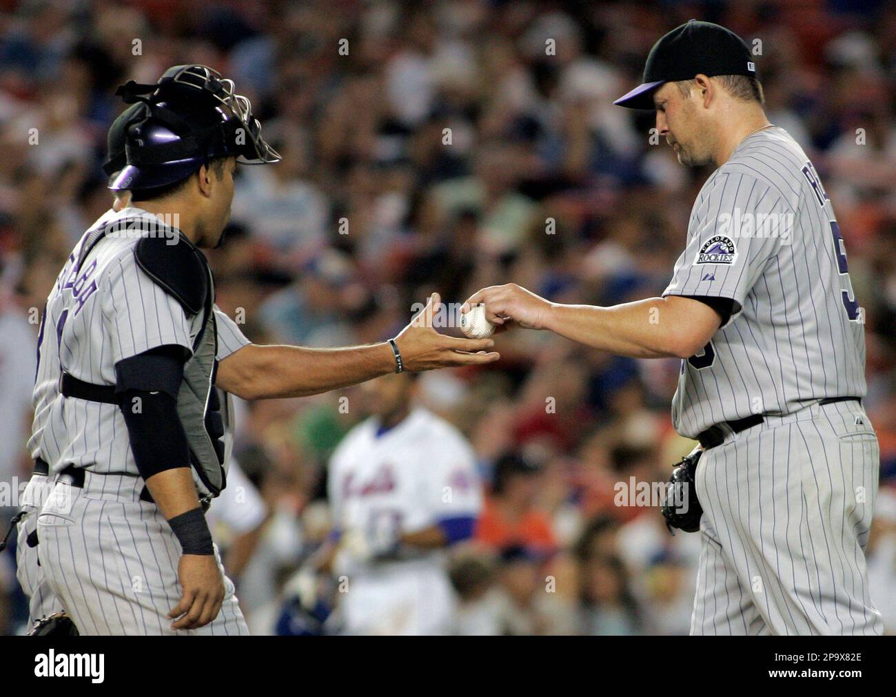 Colorado Rockies pitcher Mark Redman, right, hands the ball to manager ...