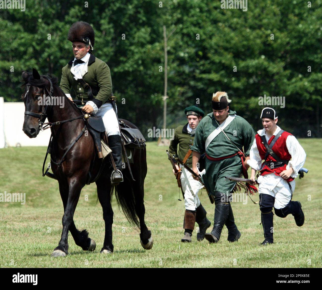 Portraying a British Dragoon, John Catalfono leads members of Col. John ...