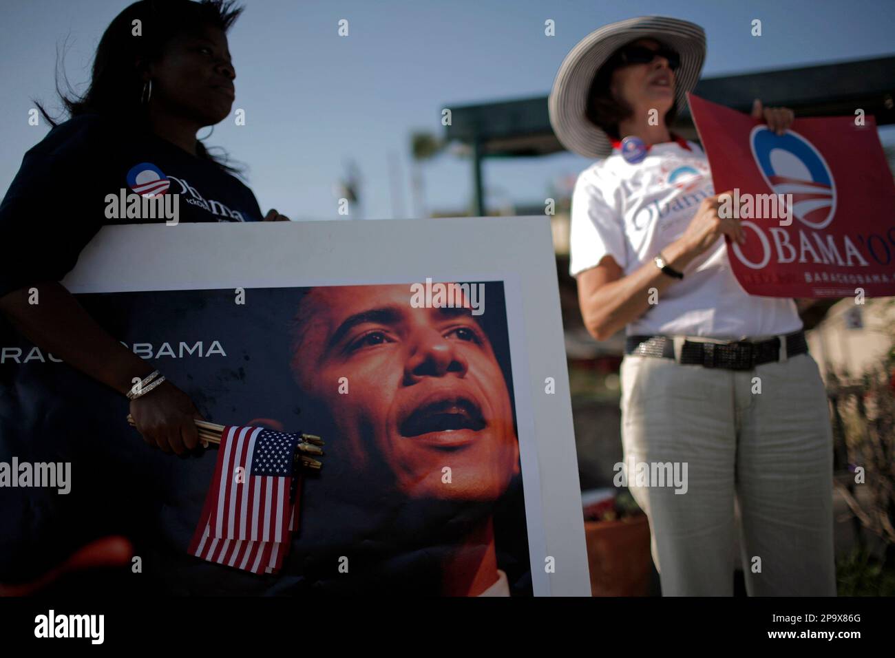 Volunteers hold signs supporting Democratic presidential candidate, Sen ...