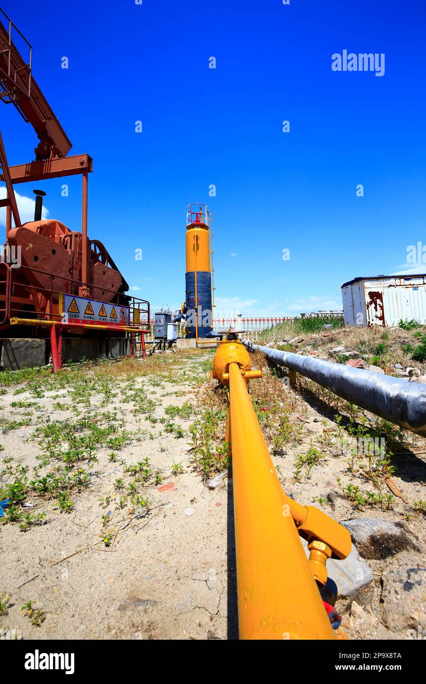 Oil pipes and valves Stock Photo - Alamy