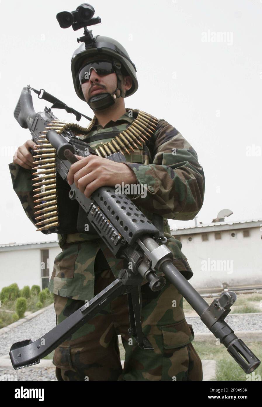 Afghan National Army soldier is seen equipped with a new weapon ...
