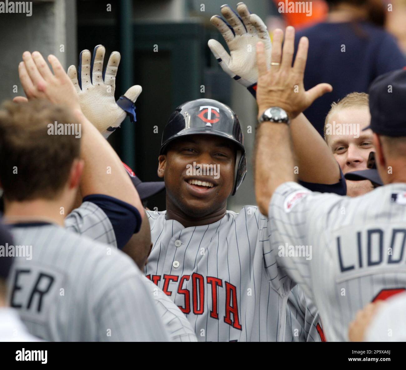 Minnesota Twins' Delmon Young celebrates scoring a run on a Brendan ...