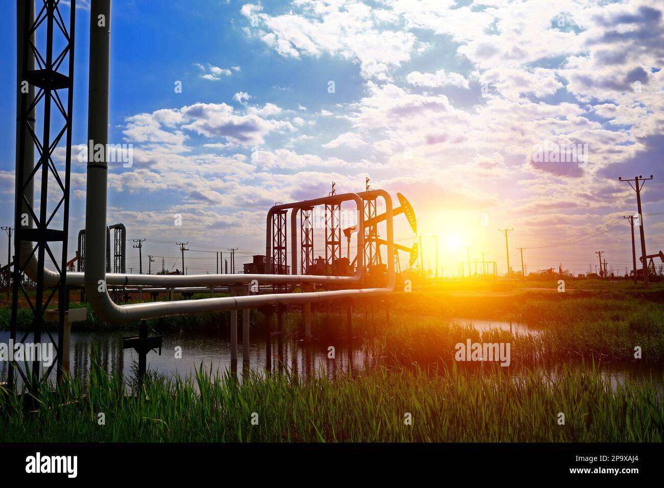 Oil pipes and valves Stock Photo - Alamy