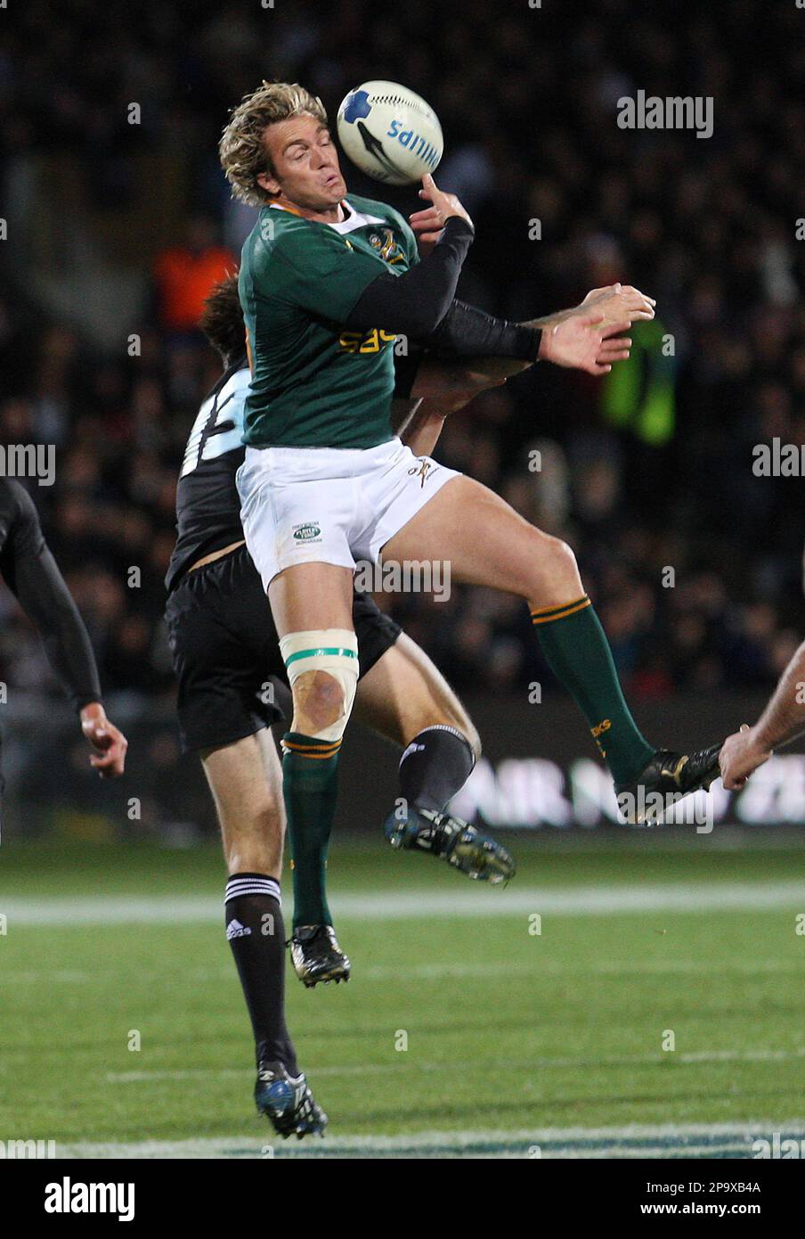 South Africas Percy Montgomery goes up for the high ball against New ...