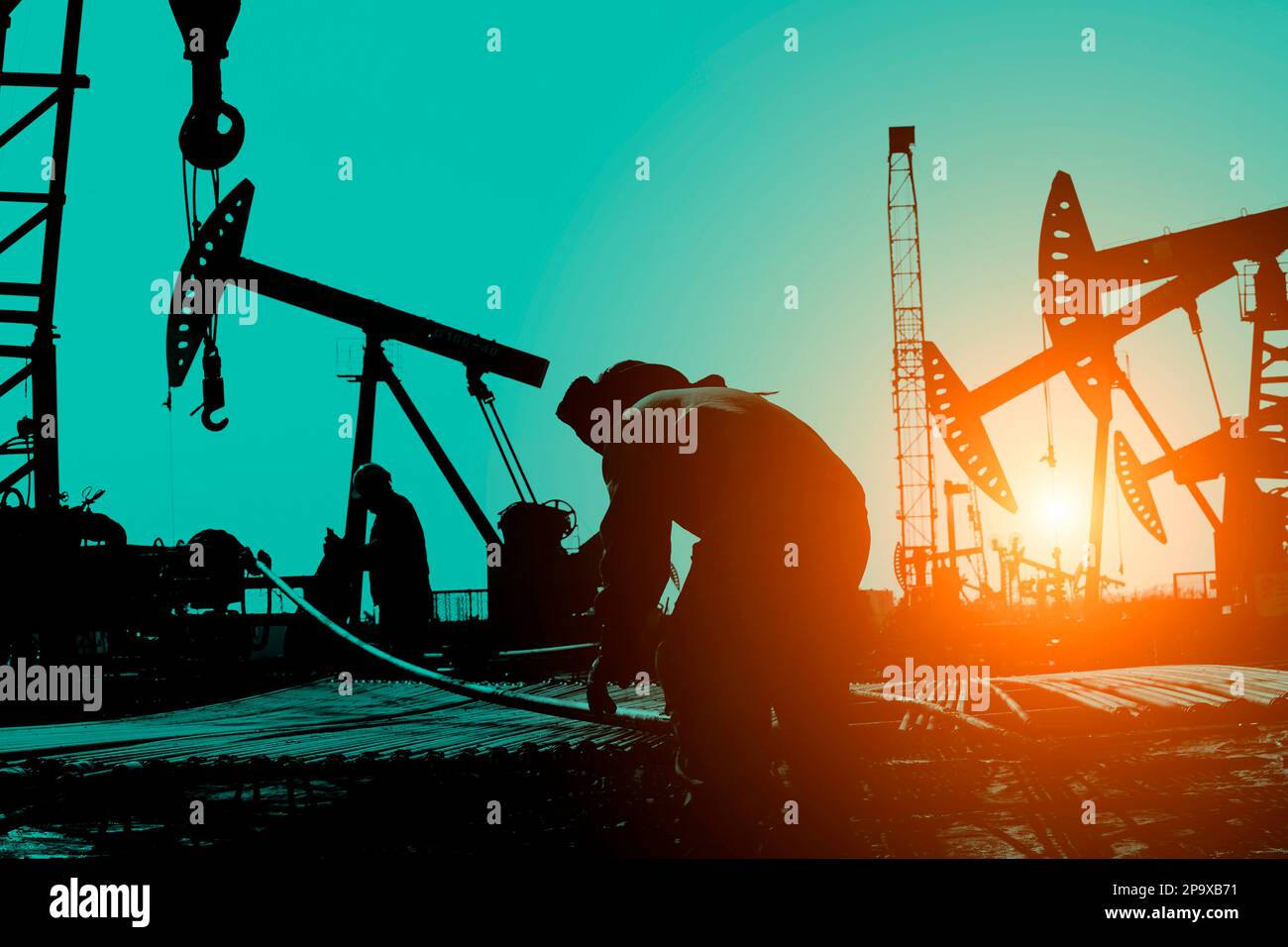 The oil workers at work Stock Photo - Alamy