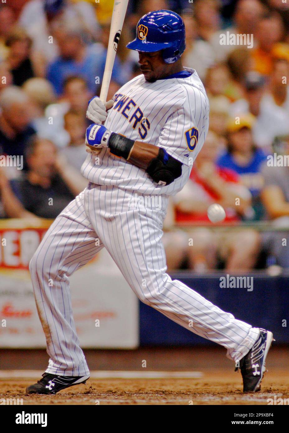 Milwaukee Brewers' Rickie Weeks is hit by a pitch from the Cincinnati ...