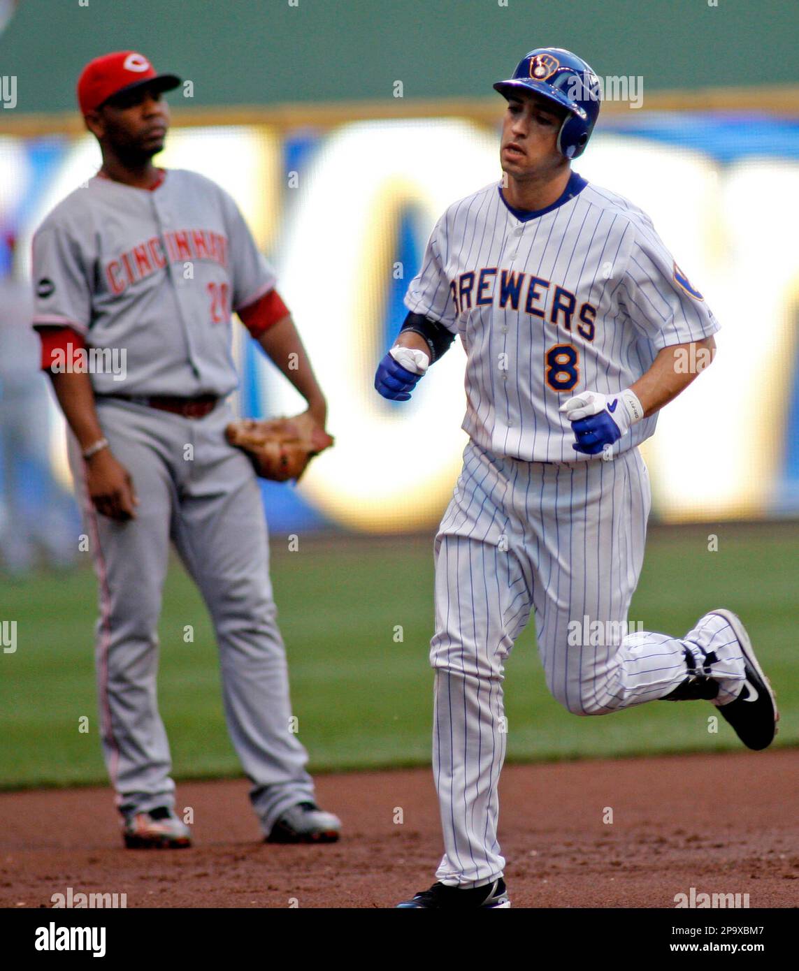 Milwaukee Brewers' Ryan Braun, right, runs the bases in front of ...