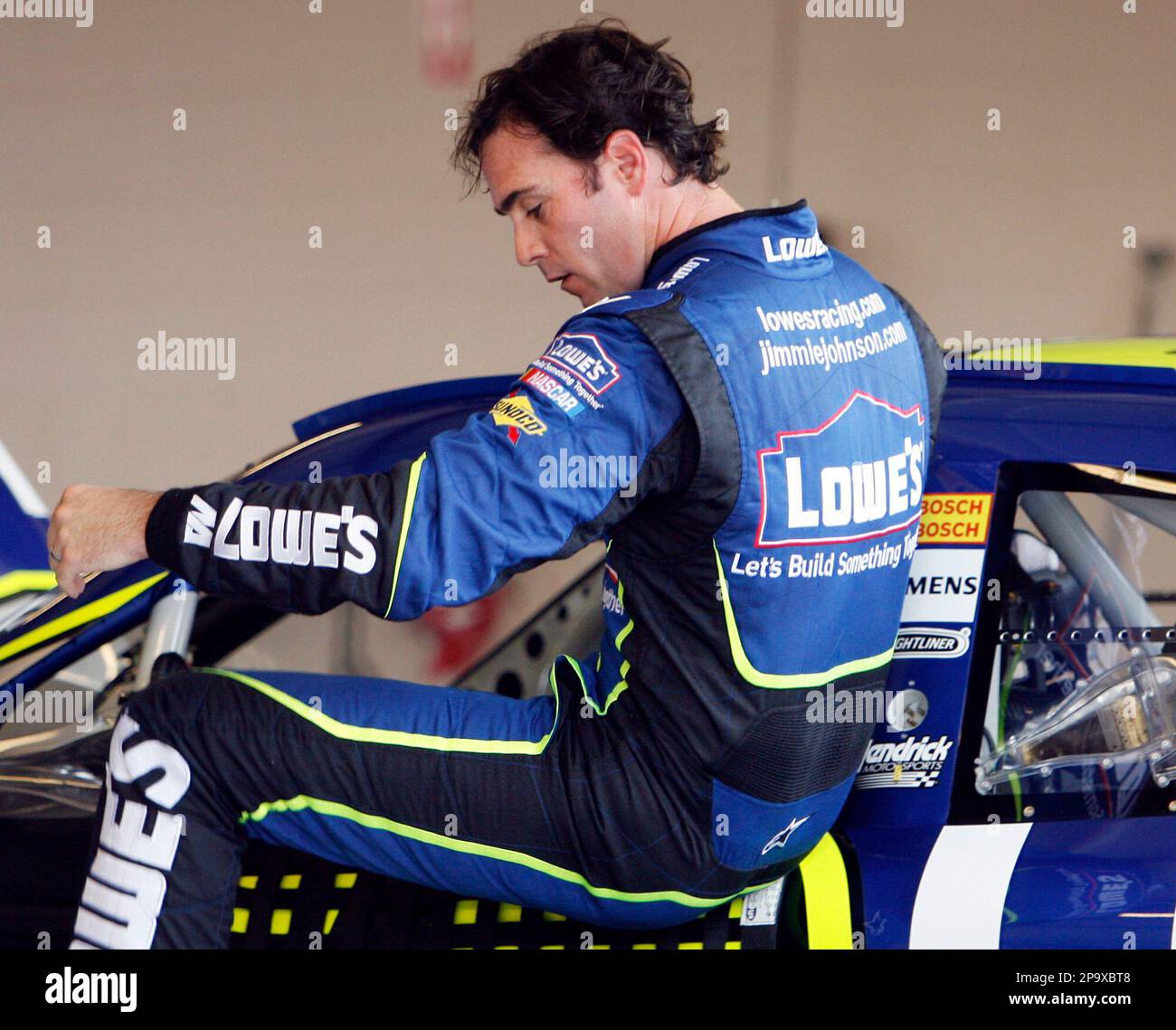Jimmie Johnson climbs out of his car in the garage during NASCAR Sprint ...