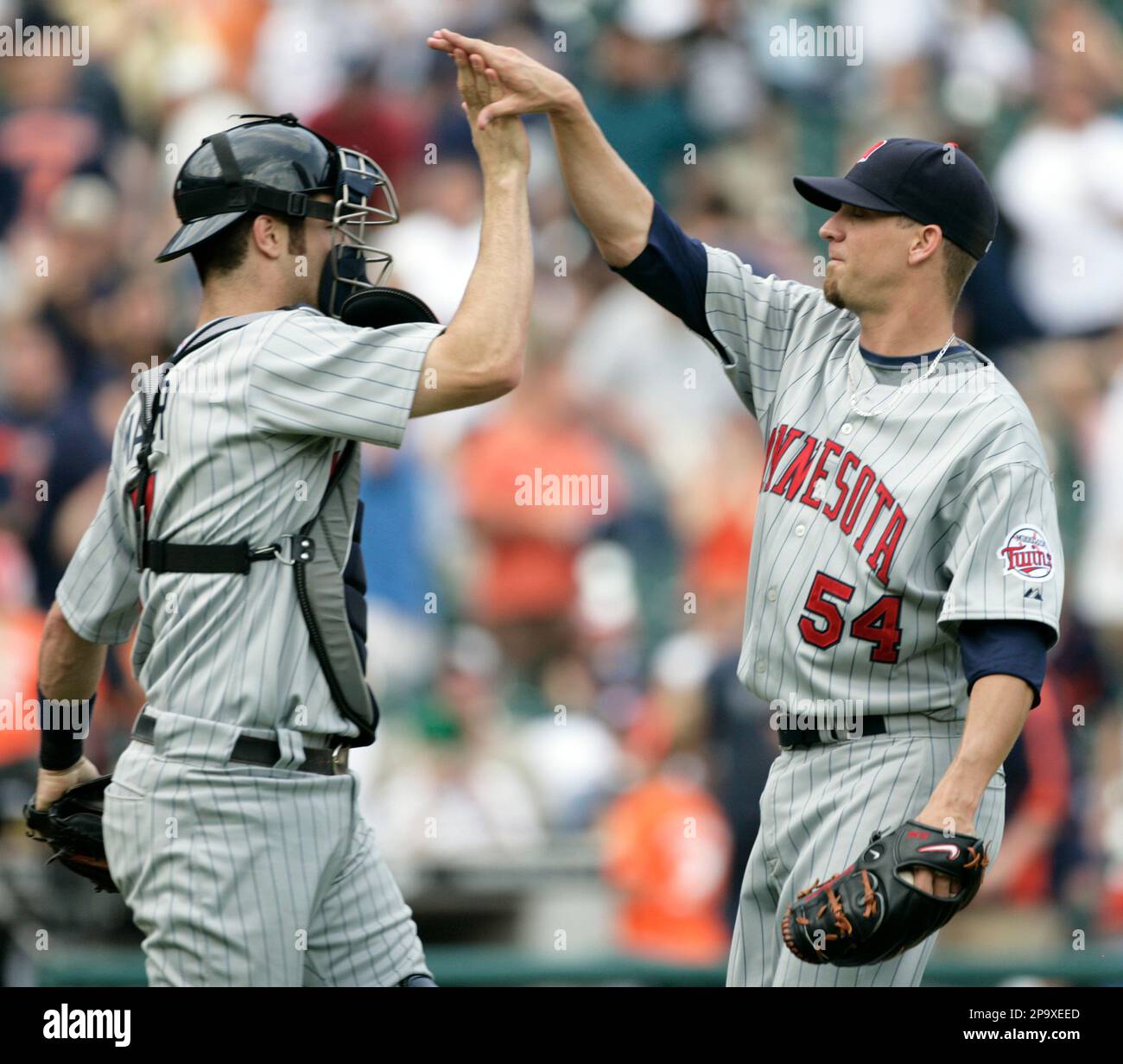 Minnesota Twins pitcher Matt Guerrier, right, and catcher Joe Mauer ...