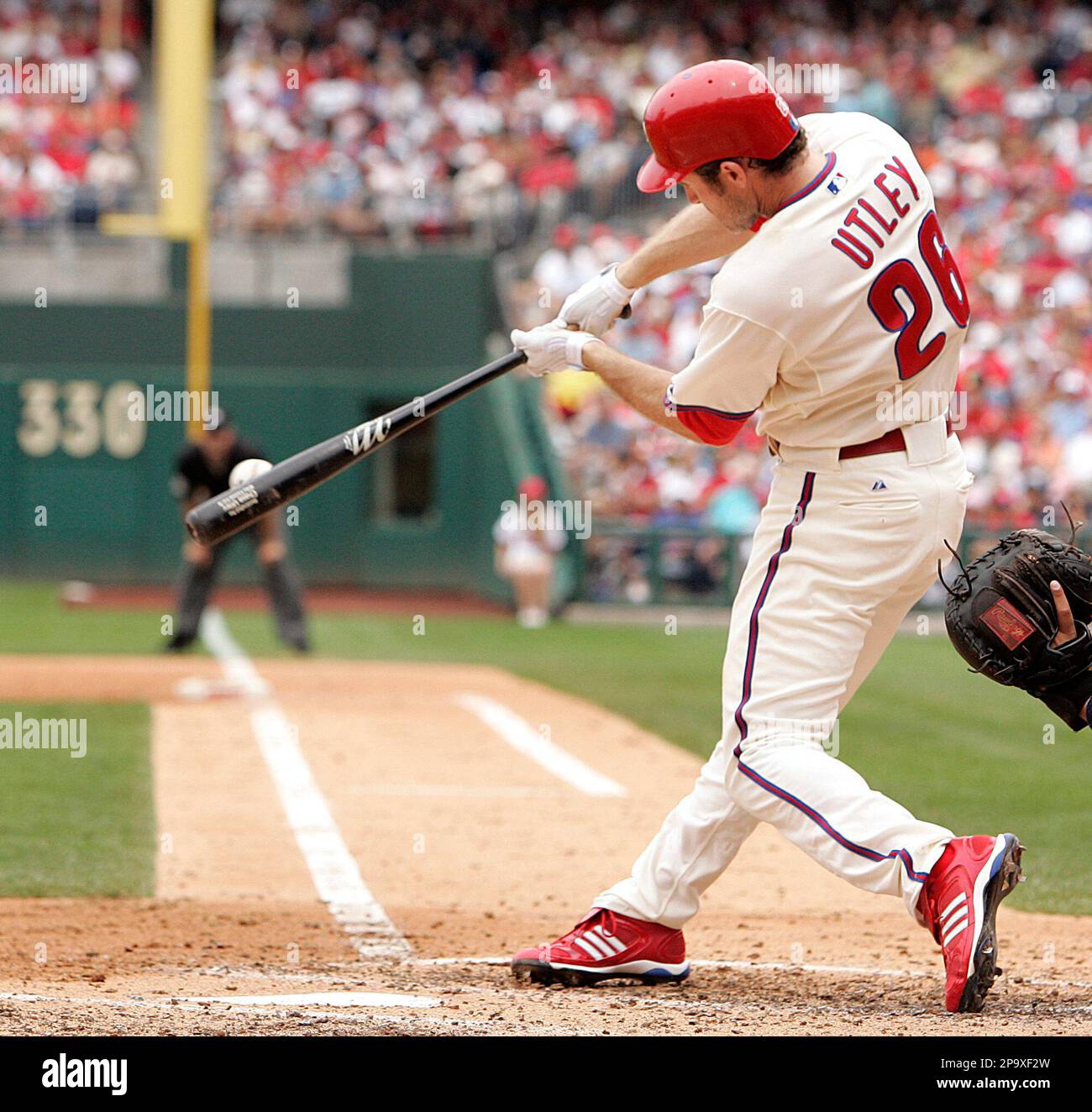 Philadelphia Phillies' Chase Utley connects for an RBI-single, driving ...
