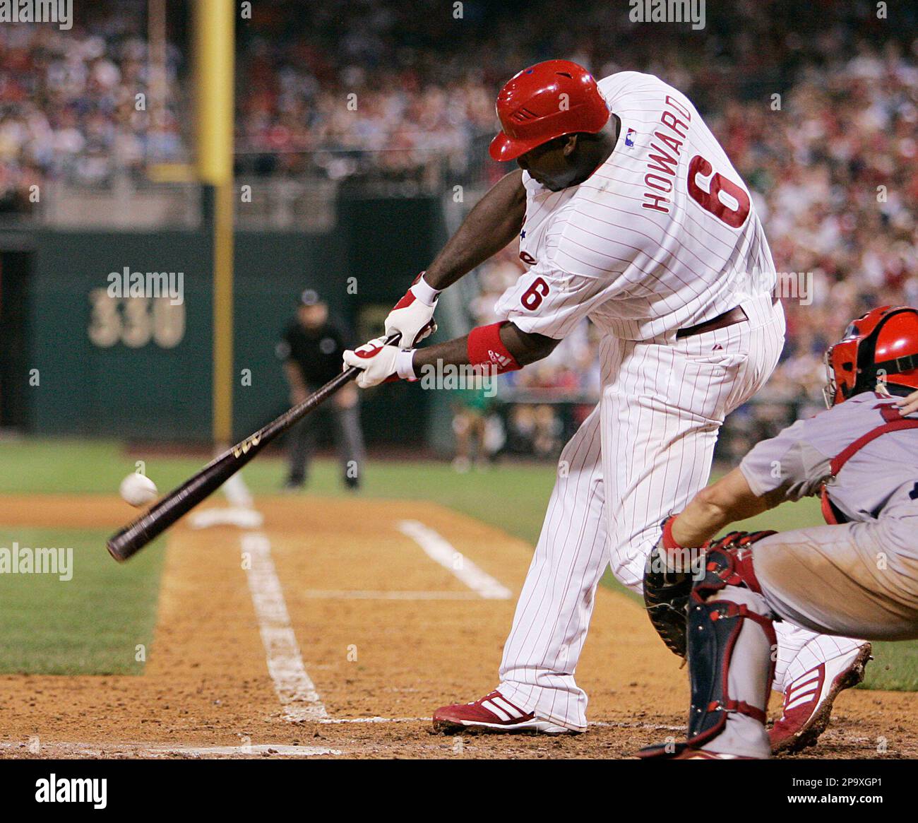 Philadelphia Phillies' Ryan Howard connects for an RBI single off of St ...