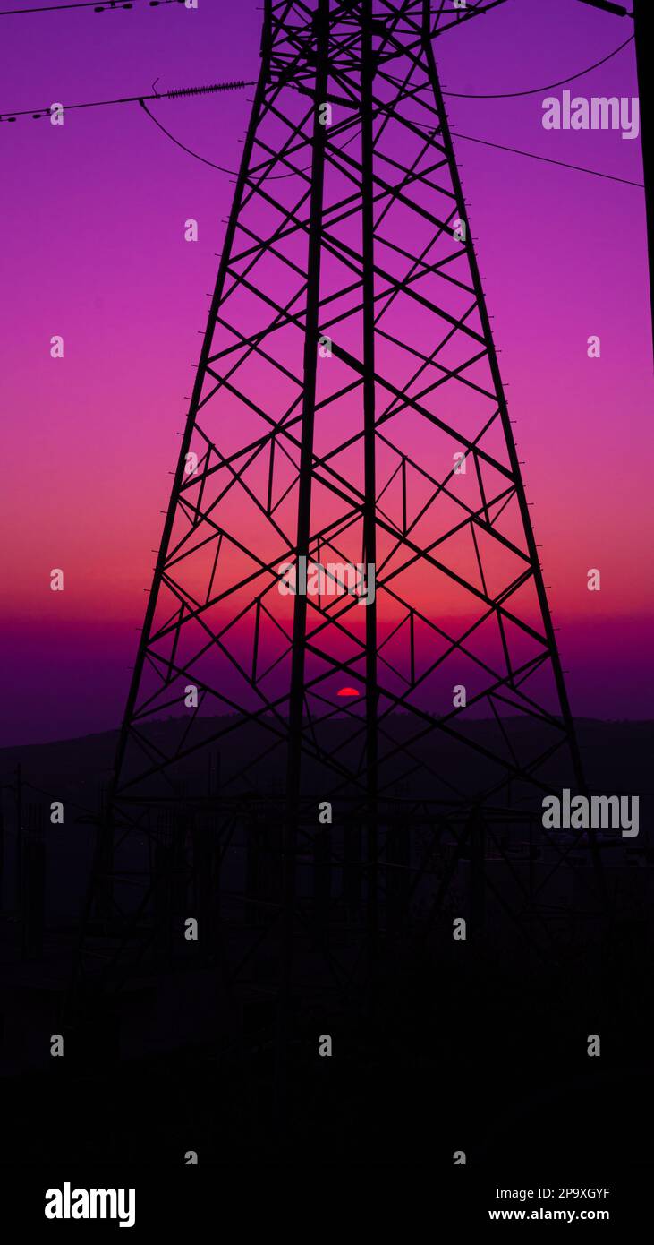 Sunset through a tower Stock Photo - Alamy