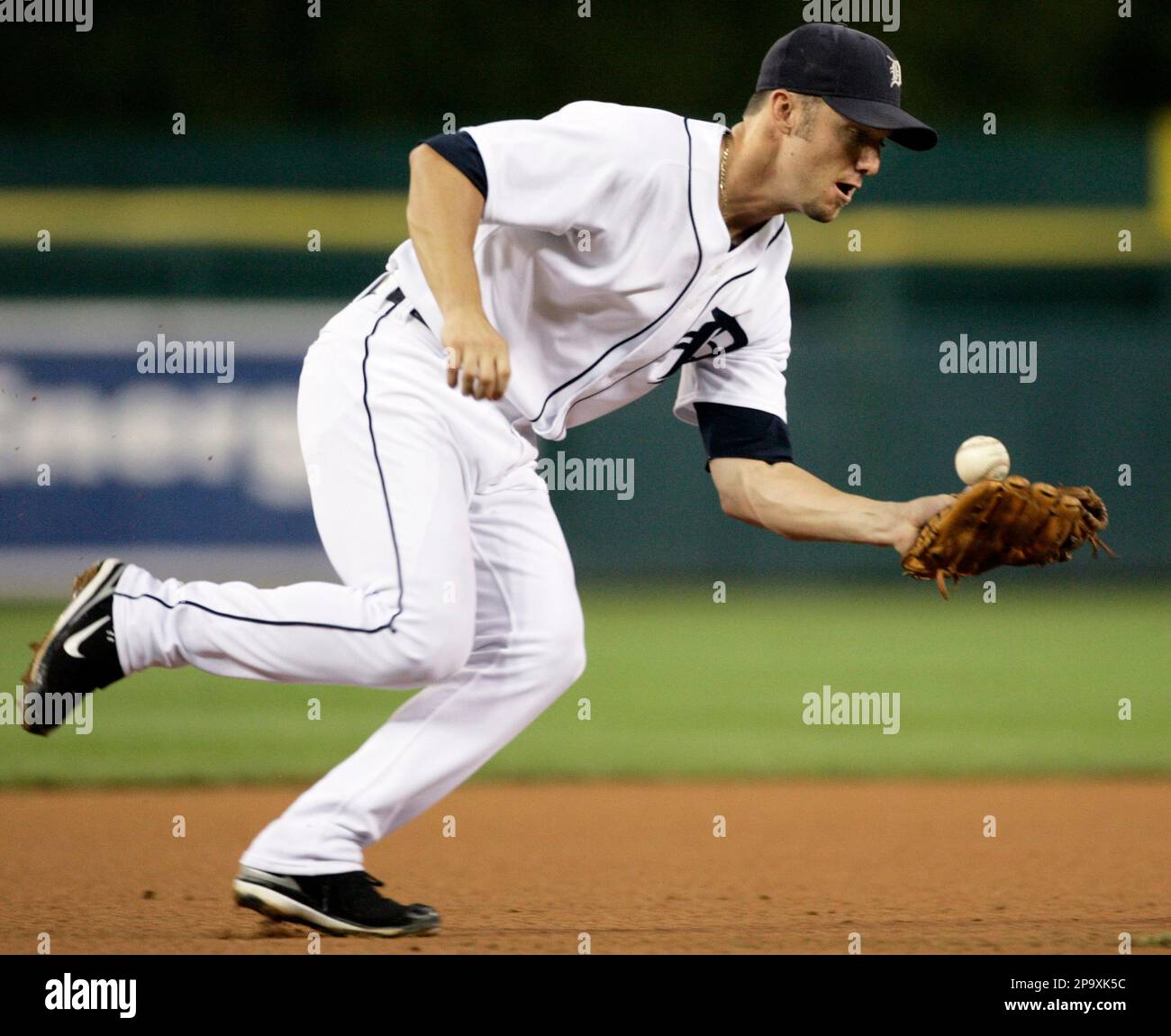 Detroit Tigers third baseman Ryan Raburn boots a grounder by Cleveland ...