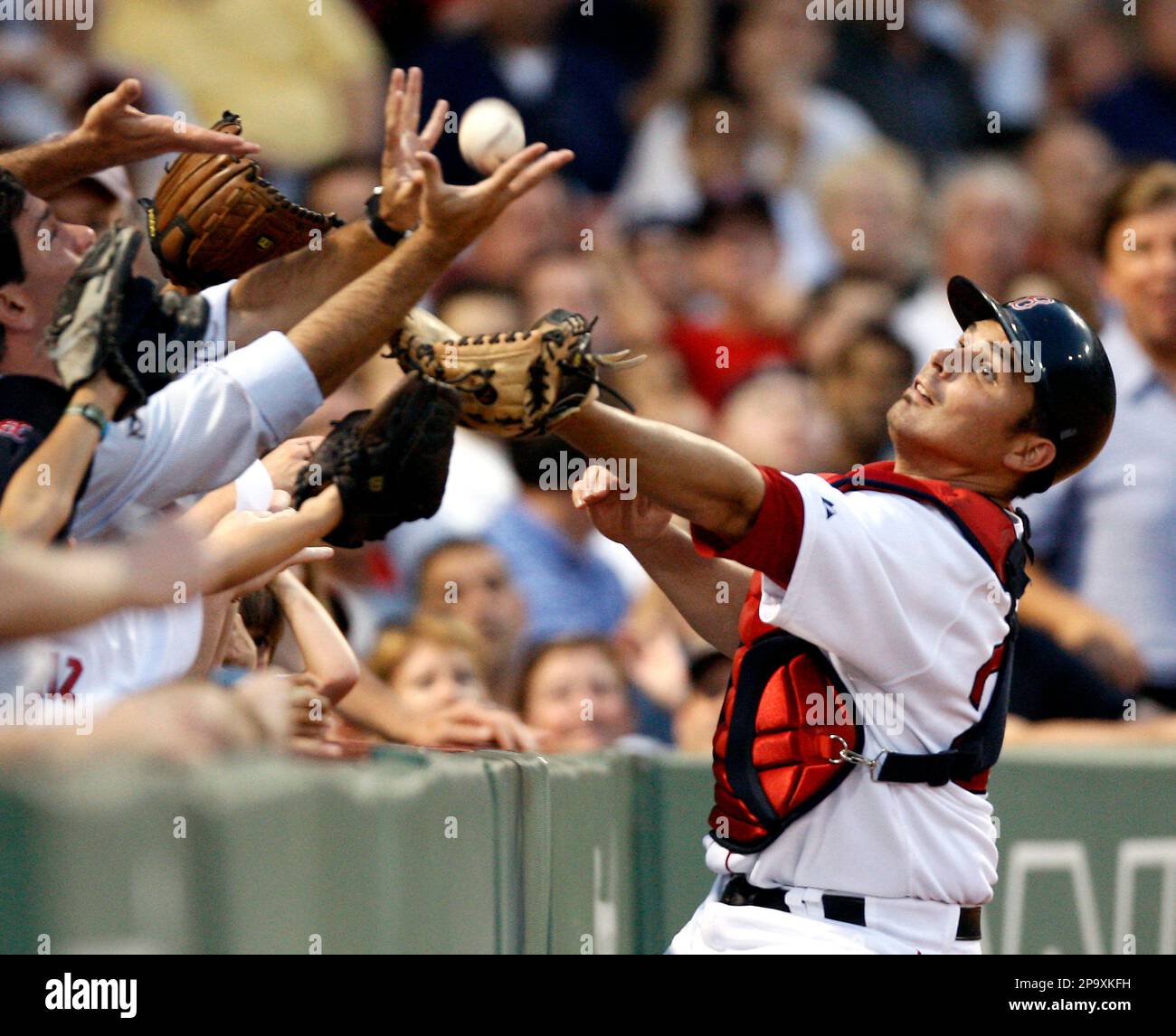 Boston Red Sox catcher Kevin Cash tries unsuccessfully to catch a foul ...
