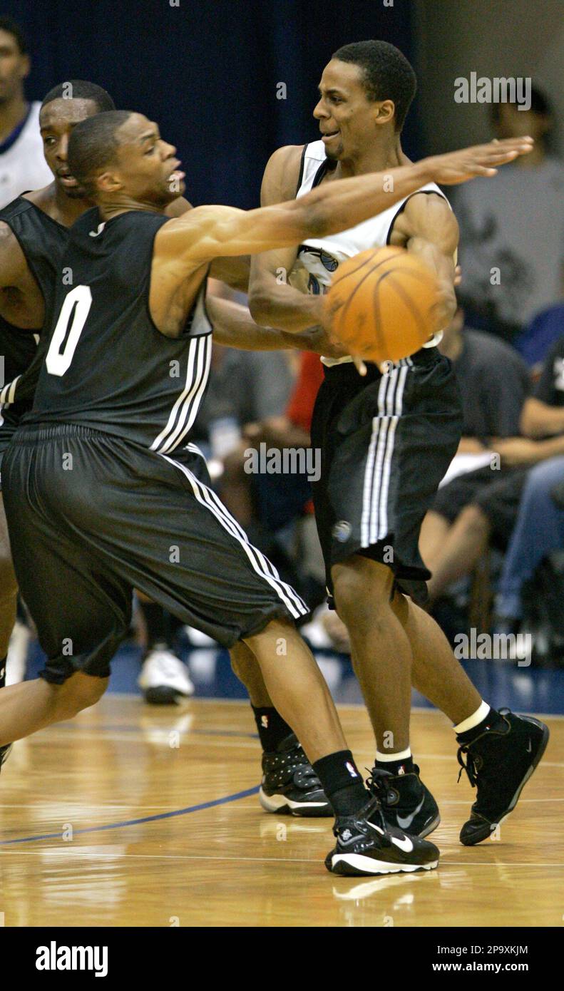 Orlando Magic guard Cliff Hammonds, right, passes the ball around ...