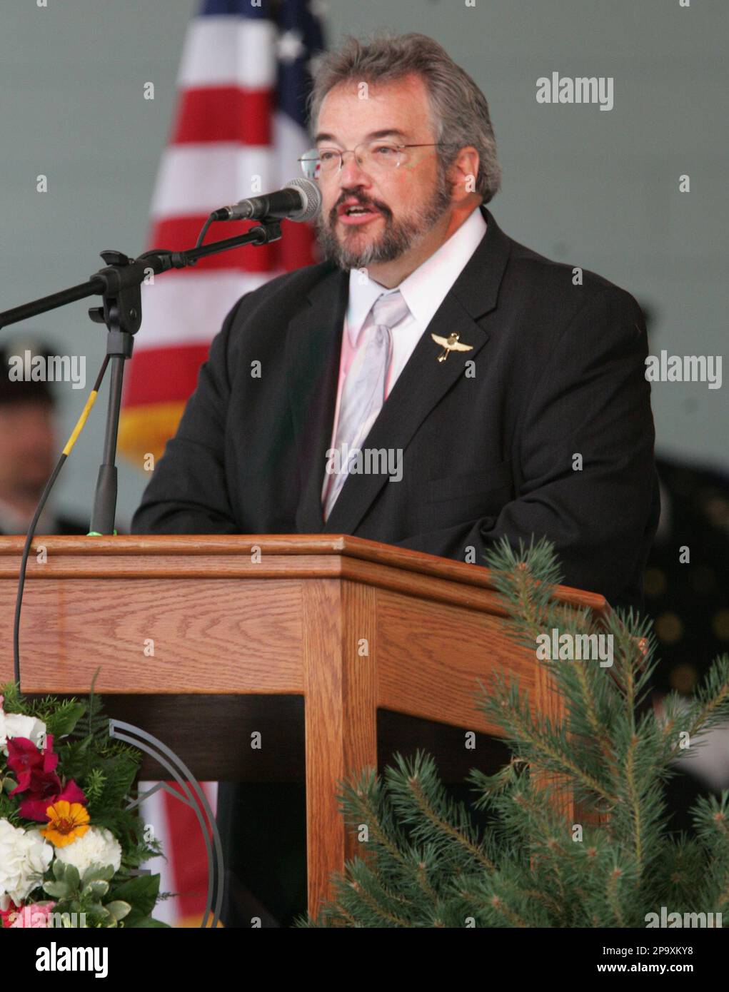 Craig Yale, Vice President of Air Methods, speaks at a memorial service ...