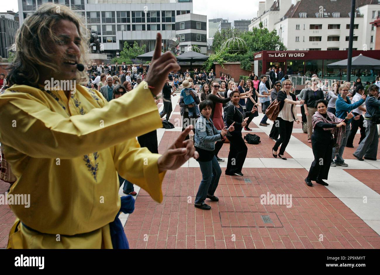 Bollywood dance choreographer Jay Kumar, left, leads the public in a ...