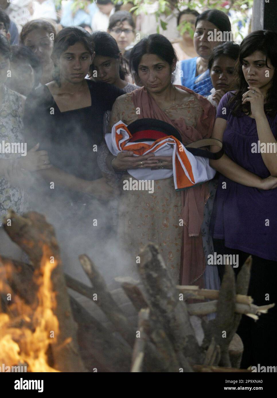 Indian Army officer R.D. Mehta's wife Sunita, holds the Indian national ...