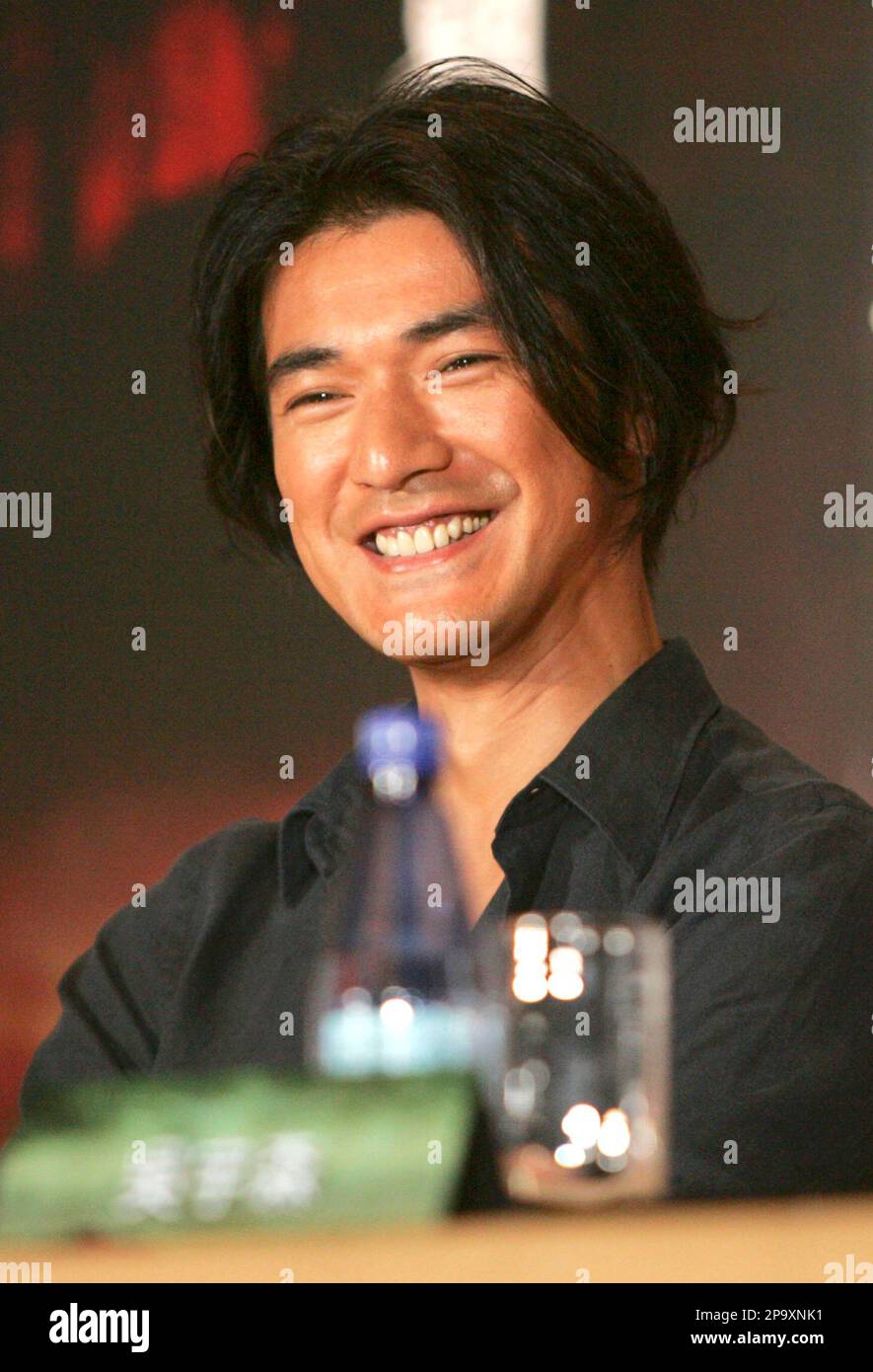Japanese-Taiwanese actor Takeshi Kaneshiro laughs as he speaks about ...