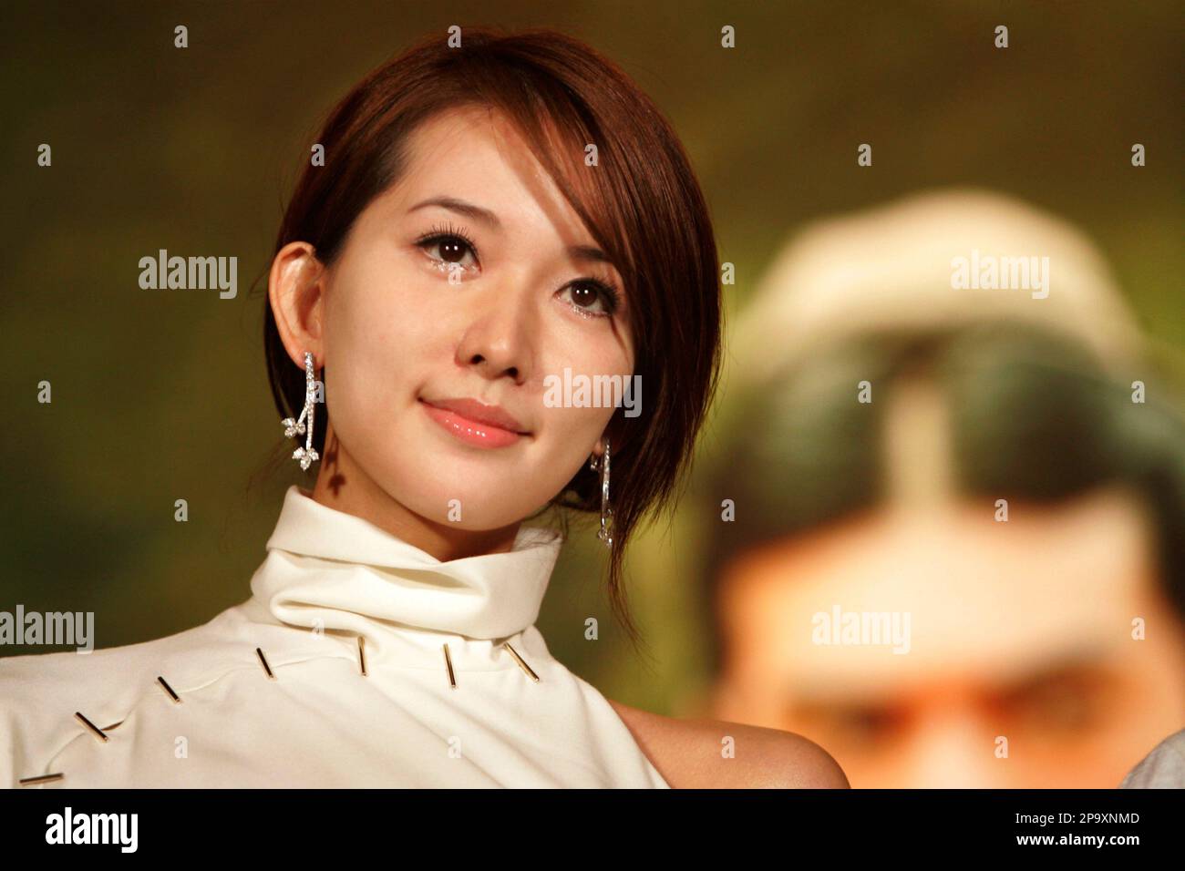 Taiwanese actress Lin Chi-ling poses for photographs during a press ...