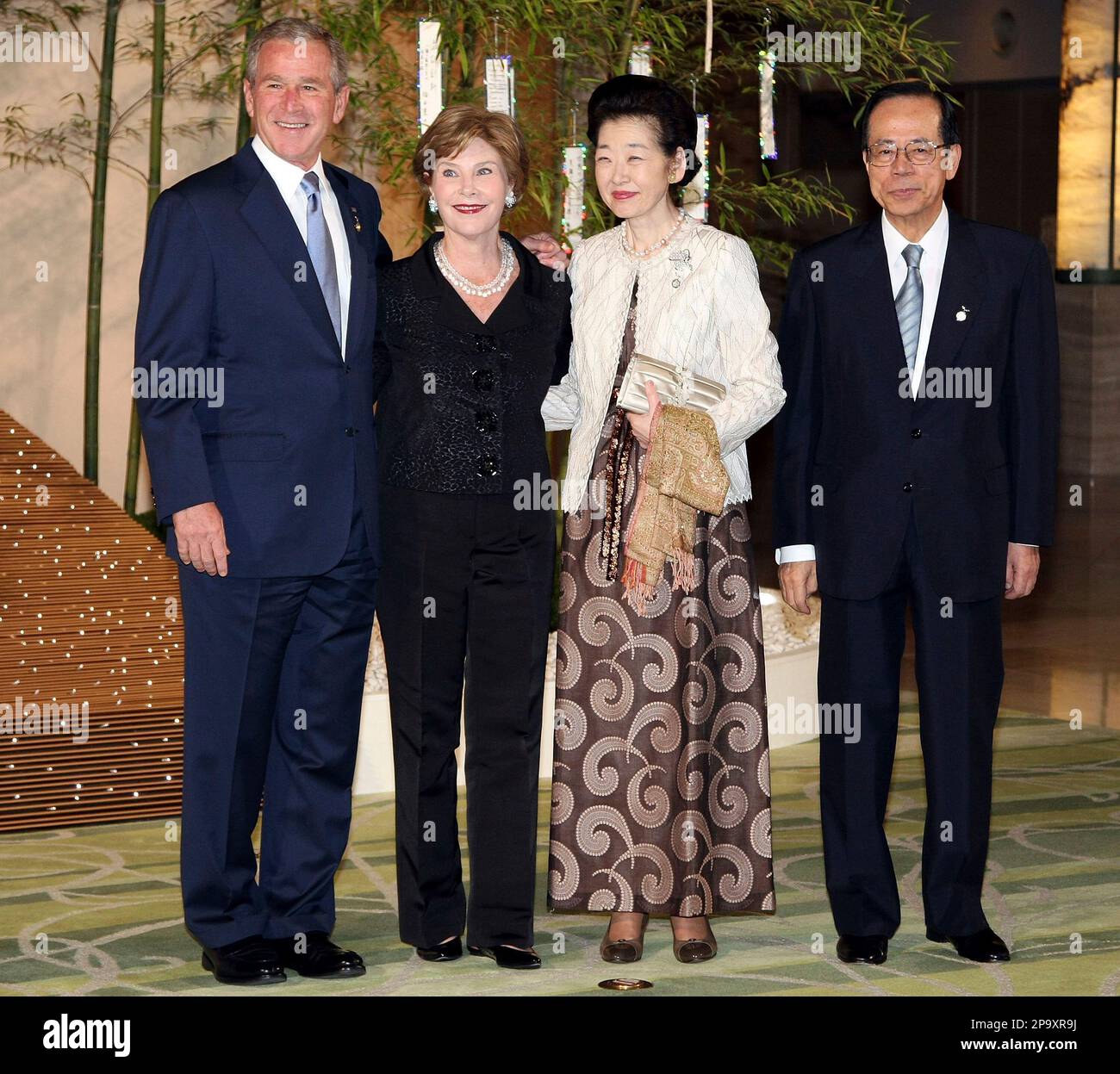 U.S. President George W. Bush, left,his wife Laura Bush, 2nd left ...