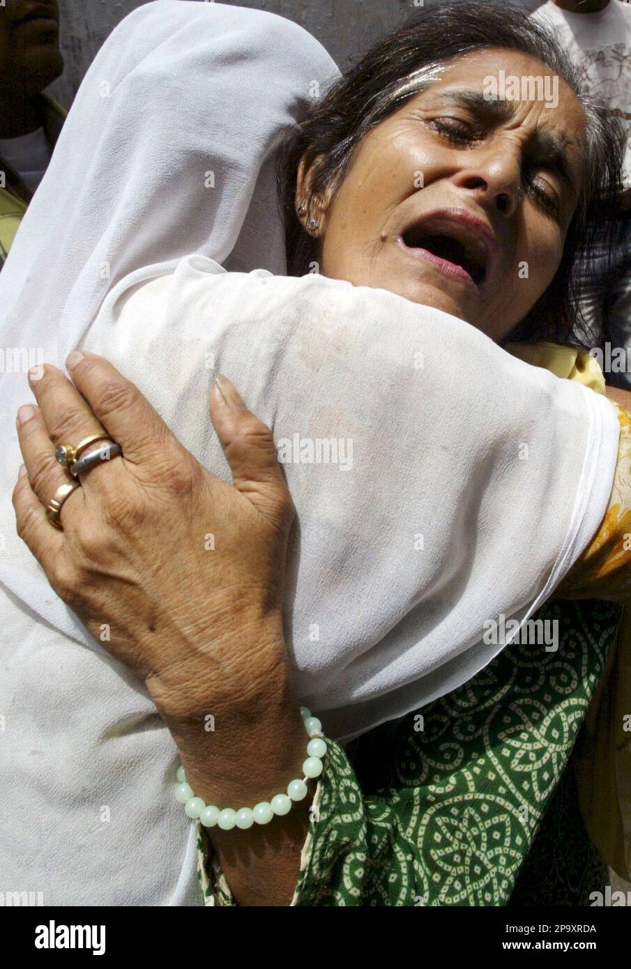 Relatives mourn the death of violence victim Ramesh Chander in Jammu ...