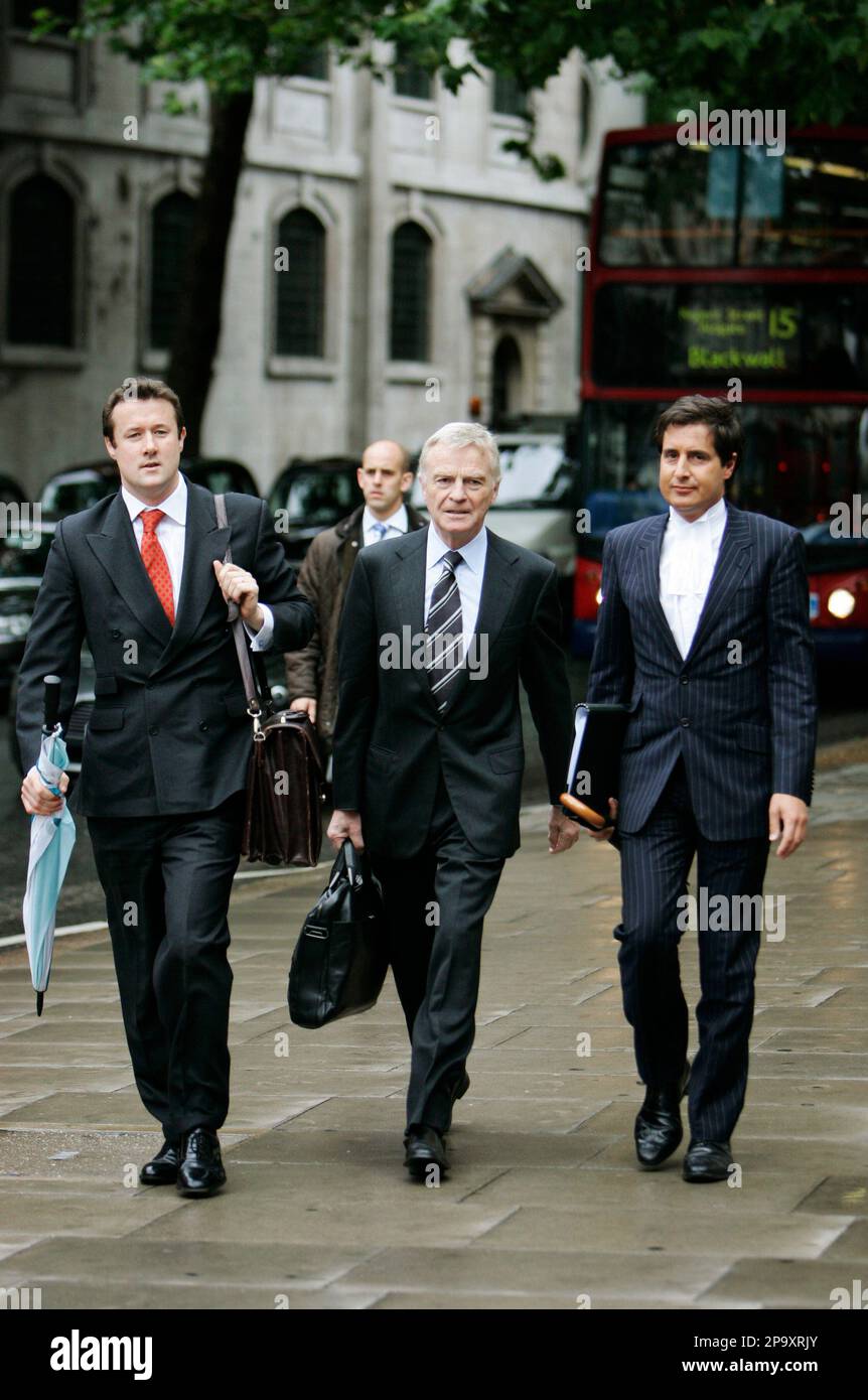 FIA President Max Mosley, center, and members of his legal team, arrive ...
