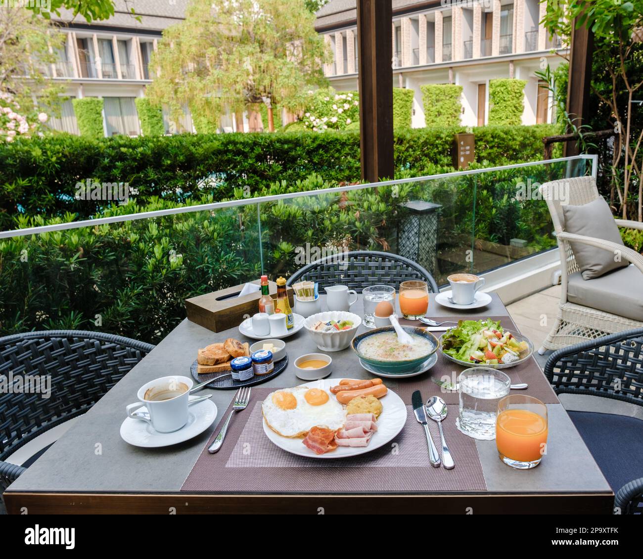 breakfast table at a luxury hotel with eggs bread and rice soup with ...