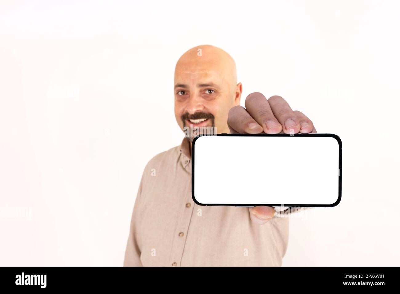 Man showing modern smartphone. Horizontal, white blank screen of big ...
