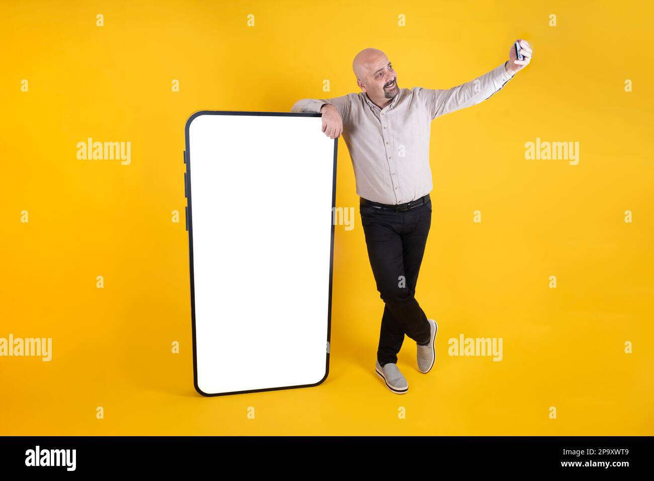 Life size full body length of caucasian male taking selfie with big ...