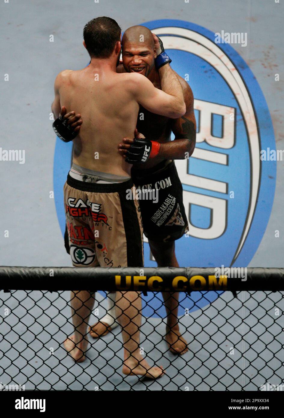 Forrest Griffin, left, and Quinton Jackson hug each other following ...
