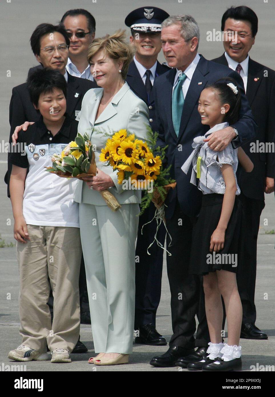 U.S. President George W. Bush , center right, and first lady Laura Bush ...