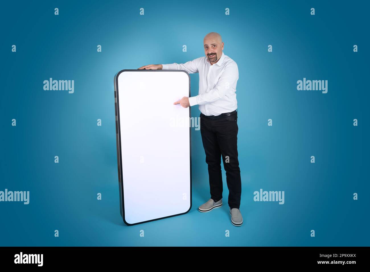 Big cell phone mock up. Pointing, touching white blank screen of ...