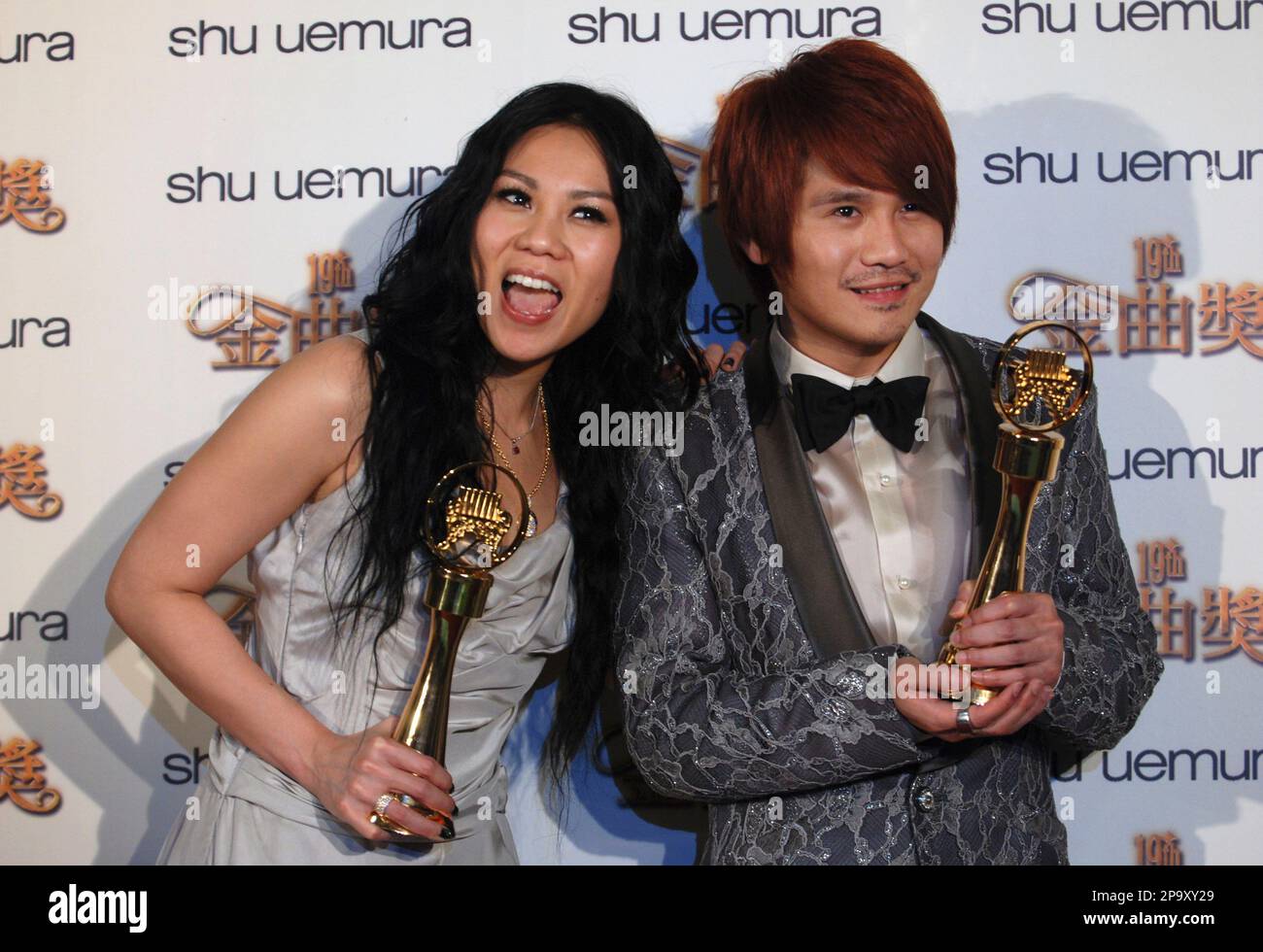 Singapore Tanya Chua, left, holds awards for "Best Female Singer" and ...